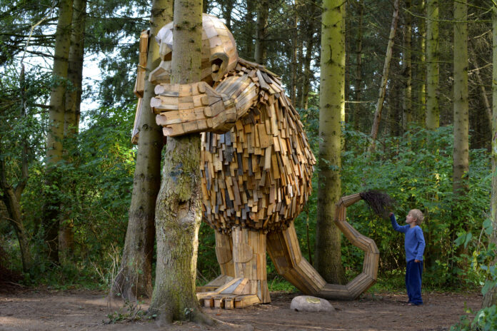 Artist Creates Wooden Giants And Hides Them In Denmark's Wilderness